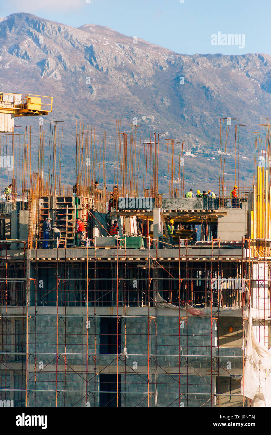 Construction of a multi-storey building. The crane is working. Budva ...