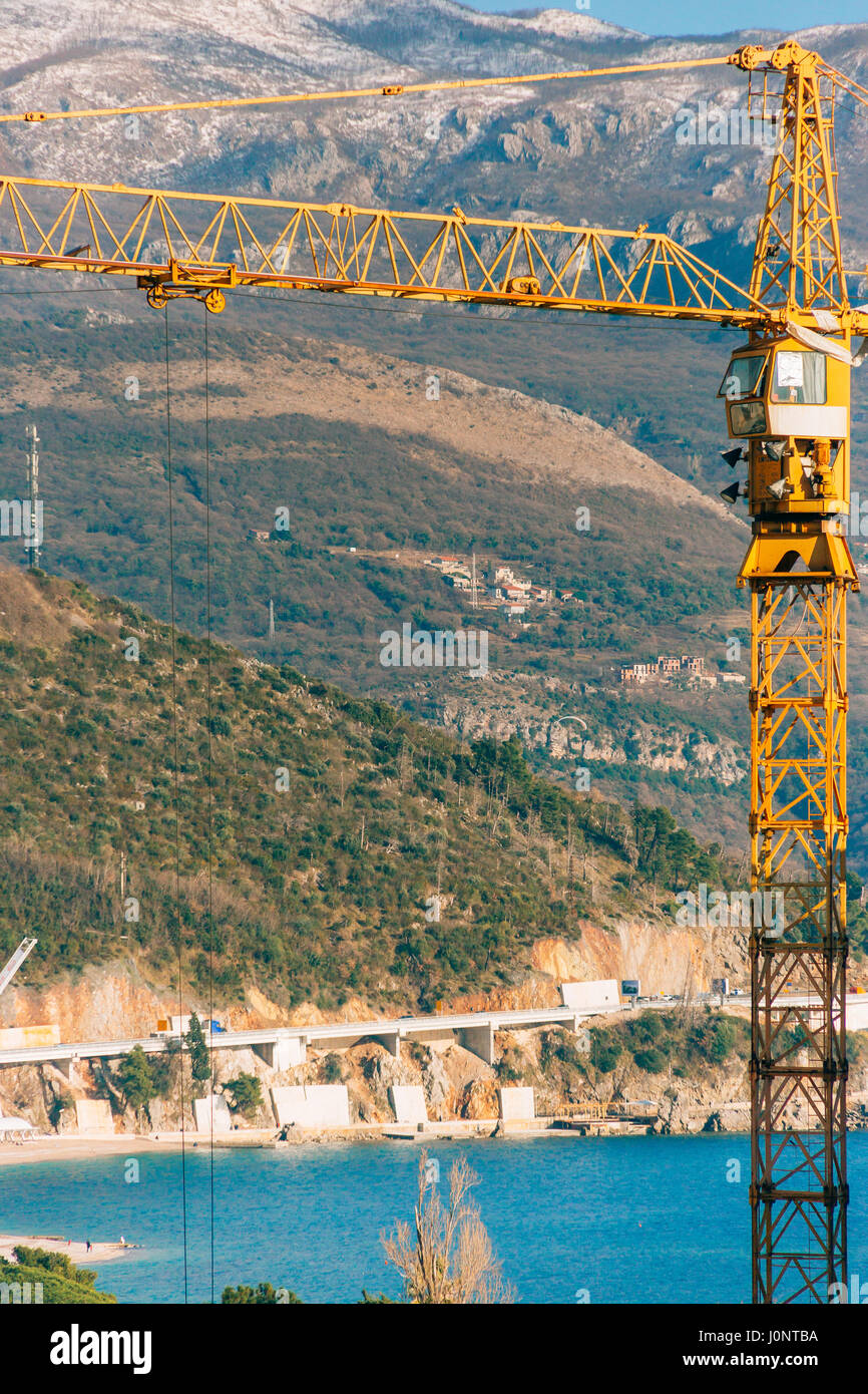 Construction of a multi-storey building. The crane is working. Budva ...