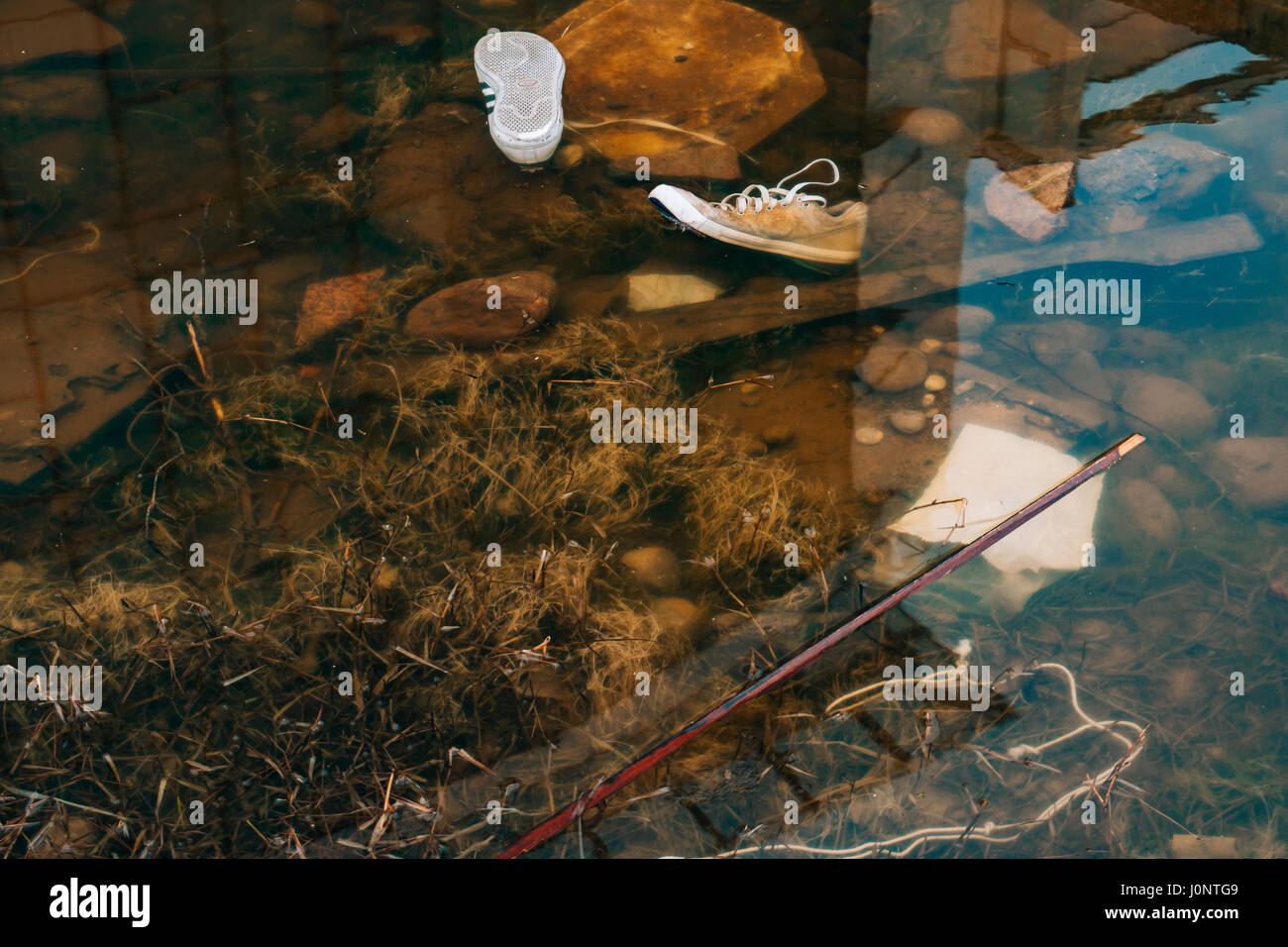 Plastic pollution ocean sneakers hi-res stock photography and images ...