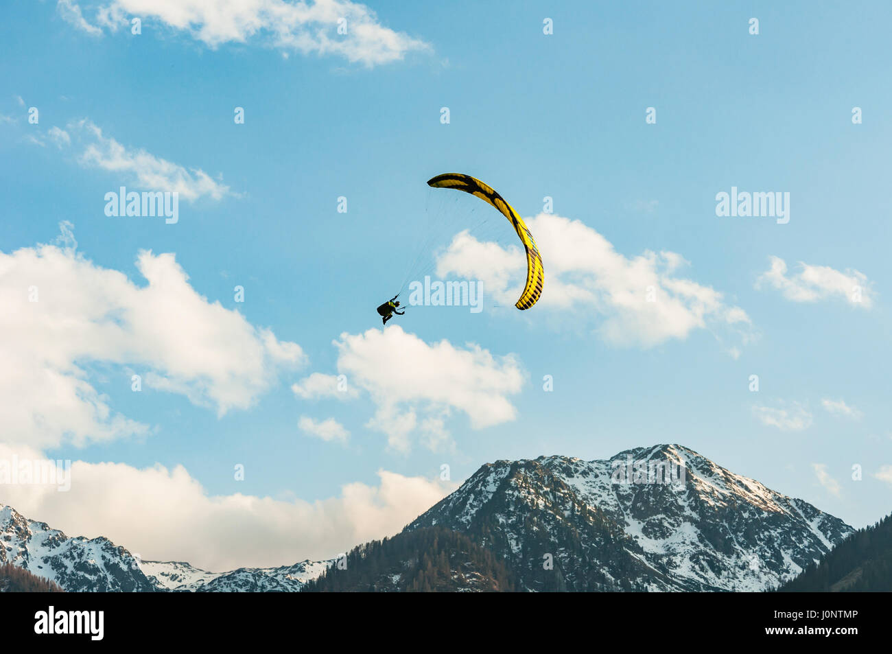 Flying between mountains in beautiful hi-res stock photography and ...