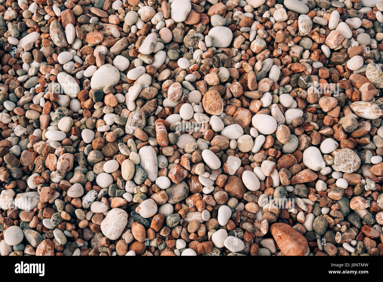 Pebbles on the beach. Texture of the sea shore. The Adriatic Sea in ...
