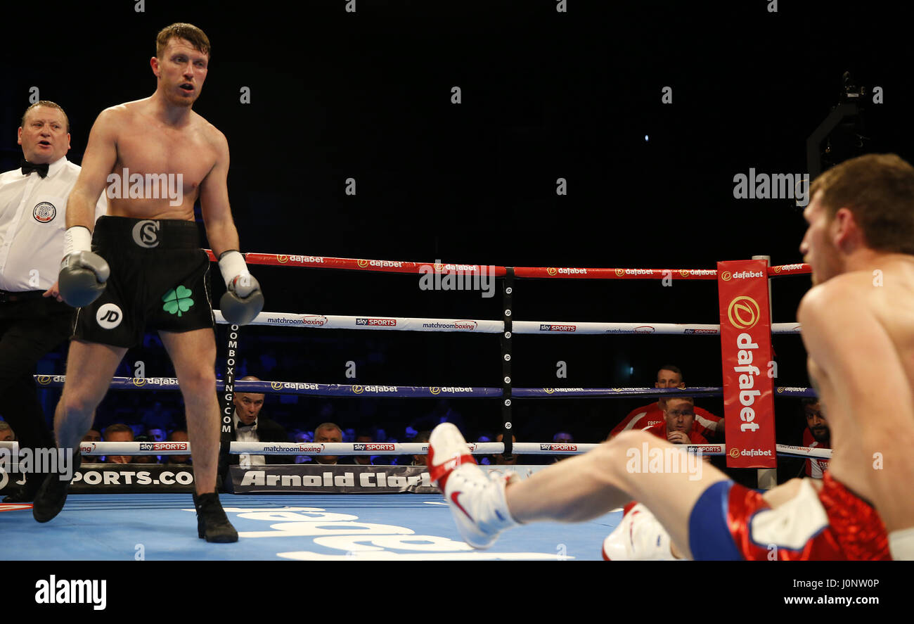 Scott Cardle knocks down Robbie Barrett during the British Lightweight ...