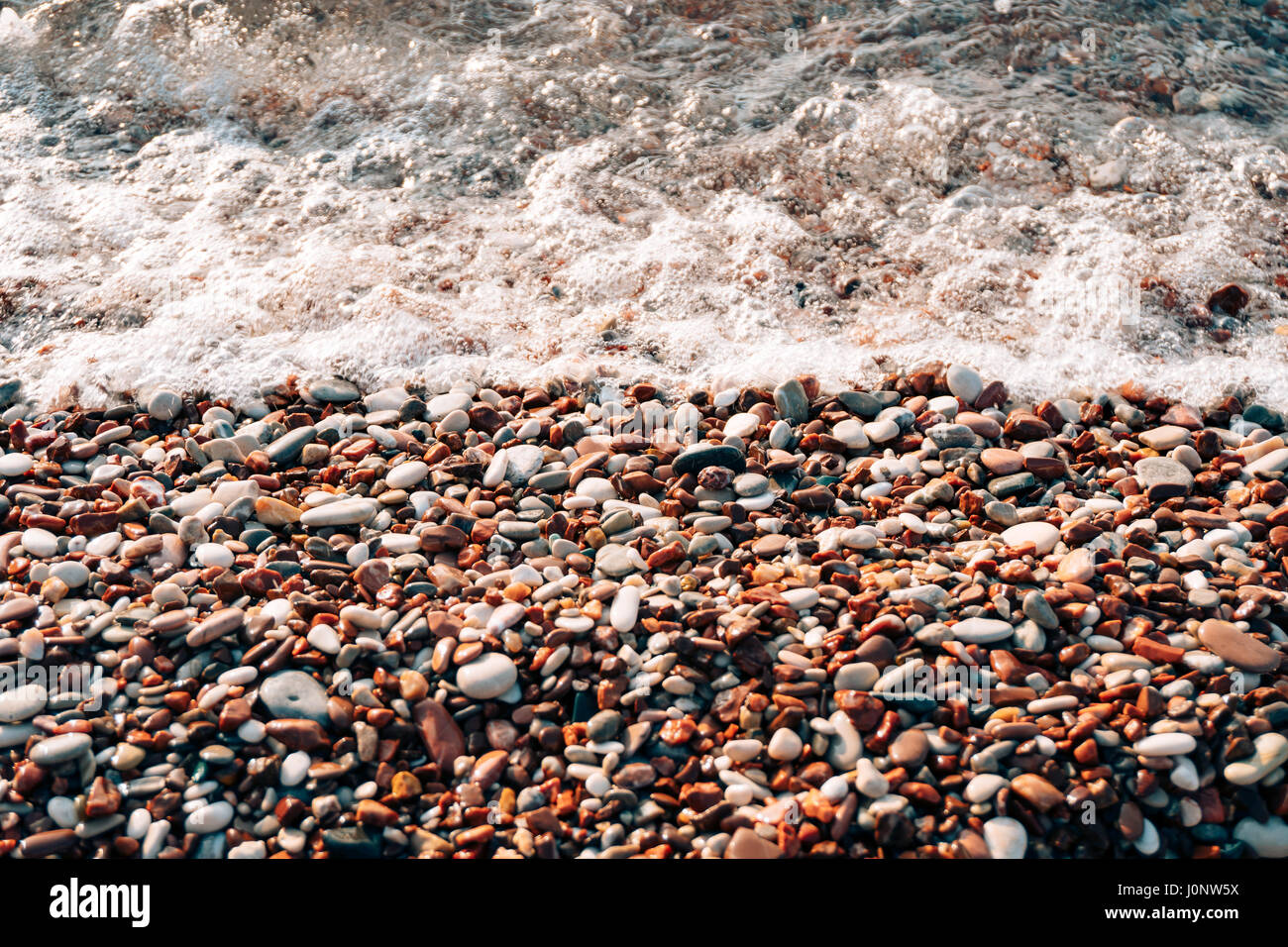 Pebbles on the beach. Texture of the sea shore. The Adriatic Sea in ...