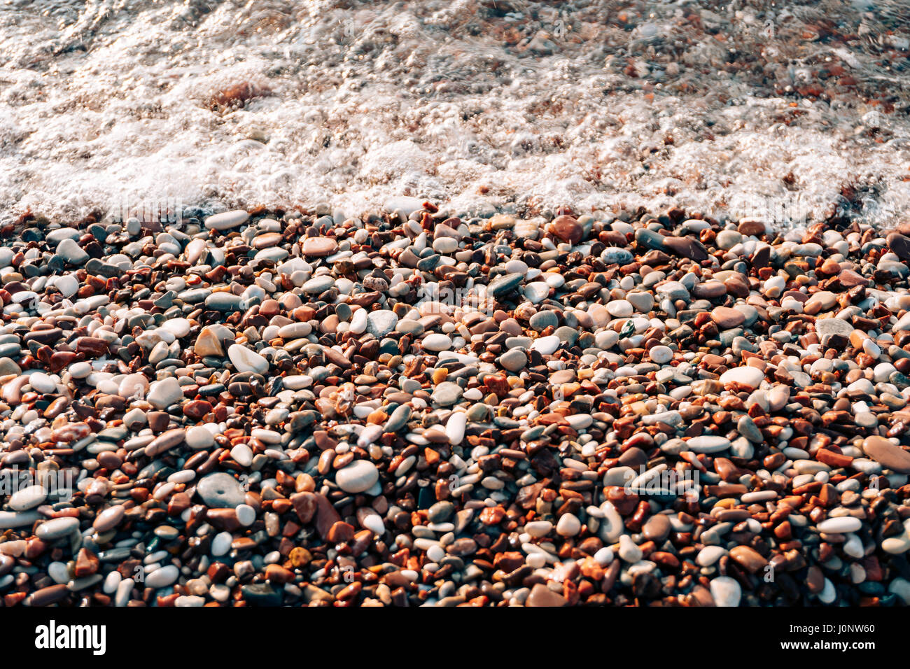 Pebbles on the beach. Texture of the sea shore. The Adriatic Sea in ...