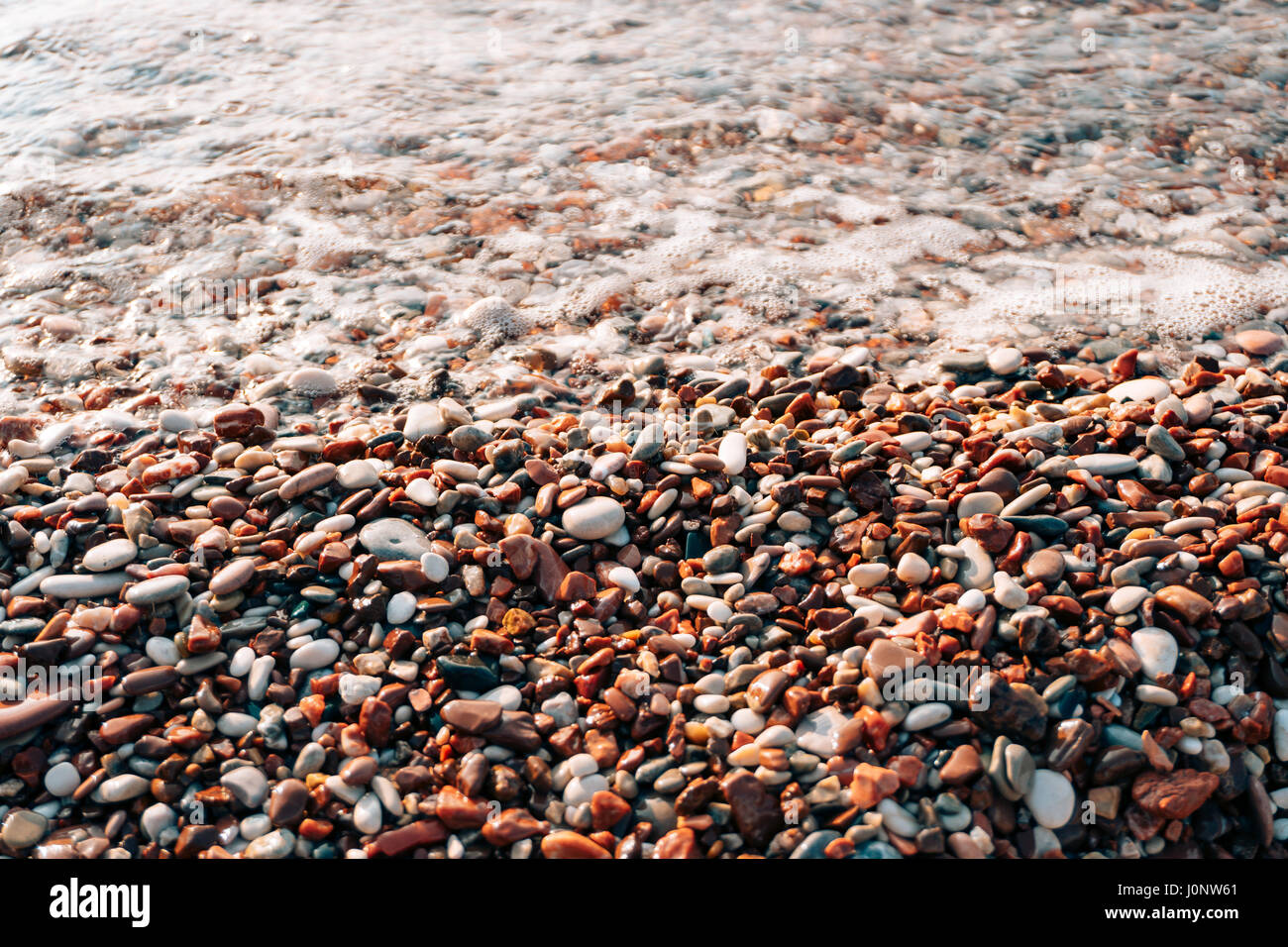 Pebbles on the beach. Texture of the sea shore. The Adriatic Sea in ...