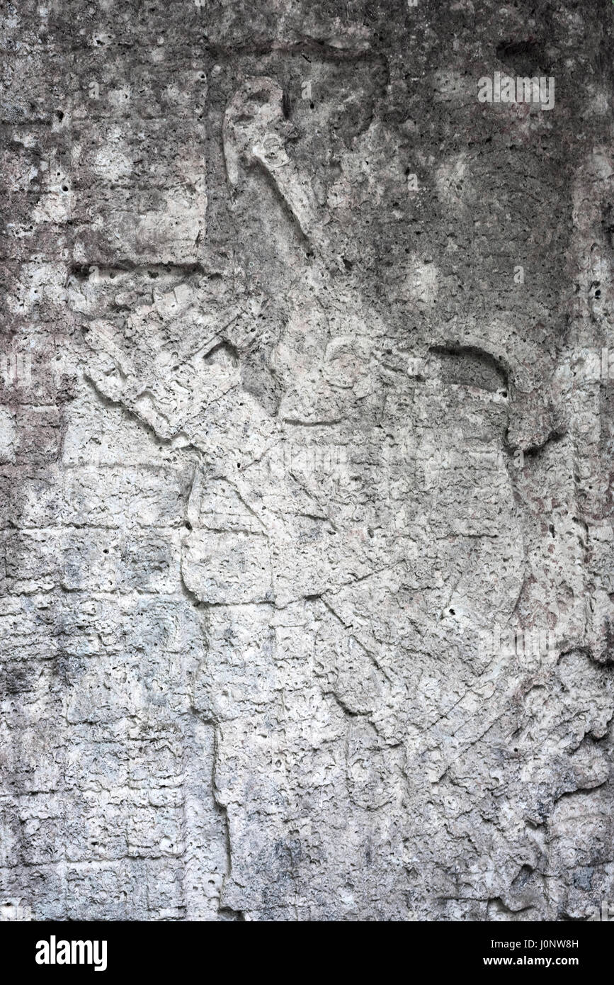 closeup detail of ancient weathered stone stele carving with fading ...