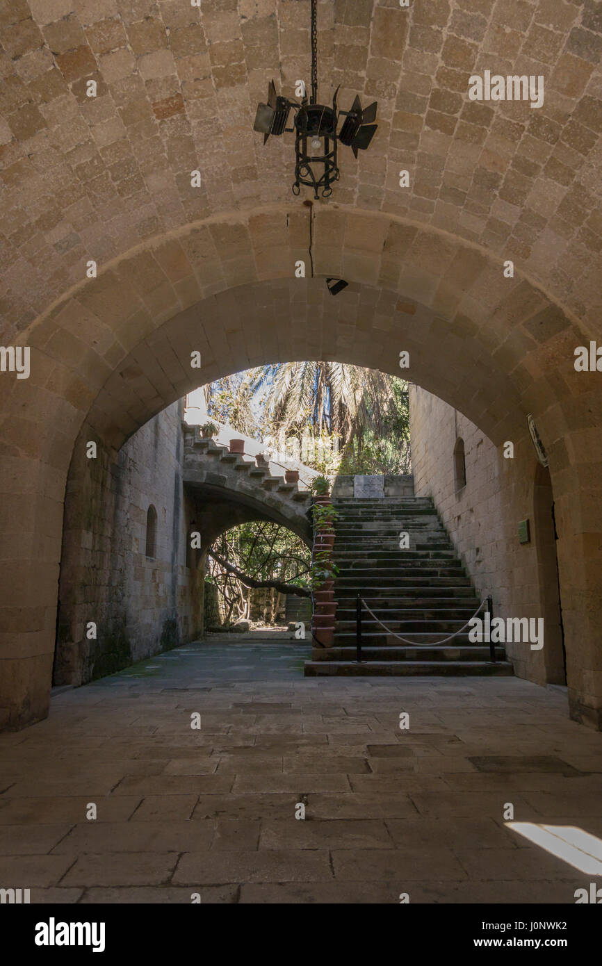 Covered, arched passage in the medieval town of Rhodes, Greece Stock ...