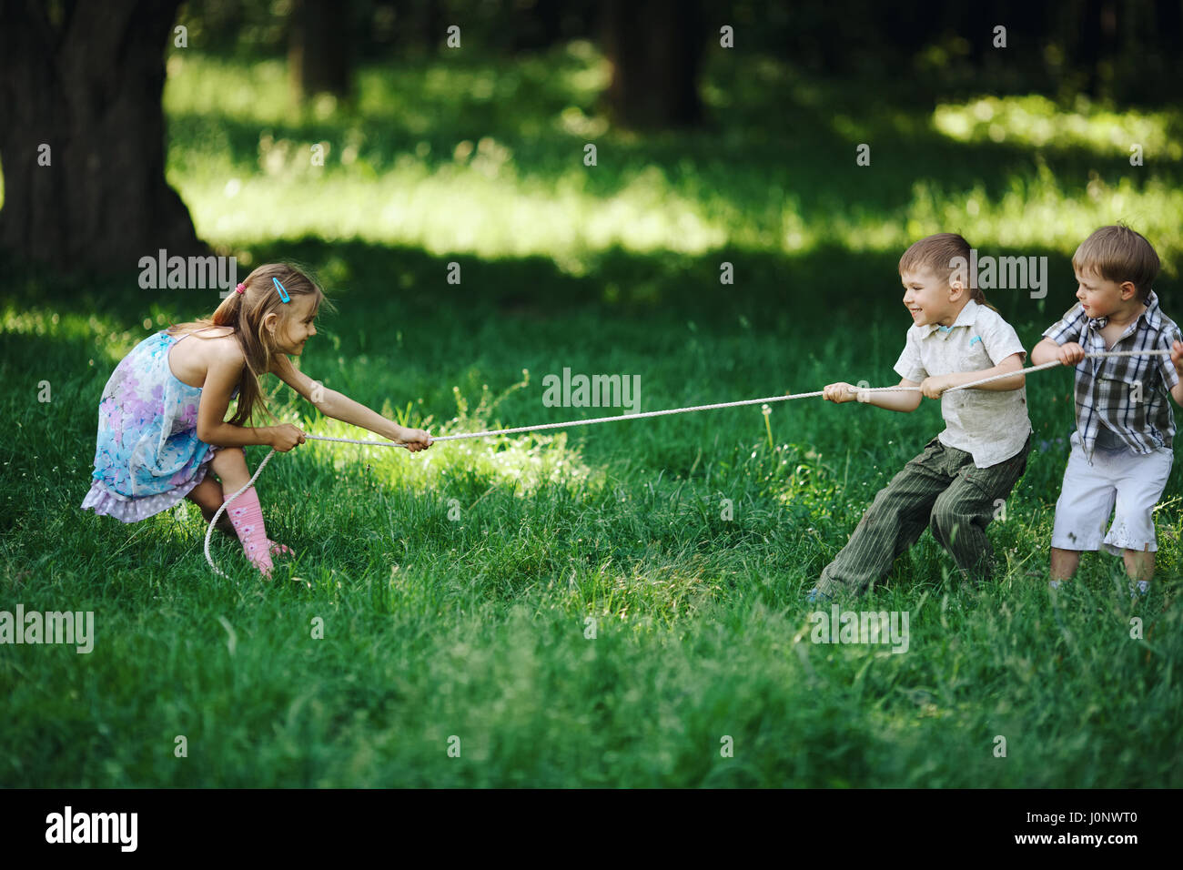 Kids pulling rope hi-res stock photography and images - Alamy