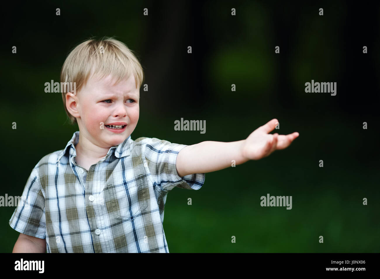 young crying boy in summer park Stock Photo - Alamy