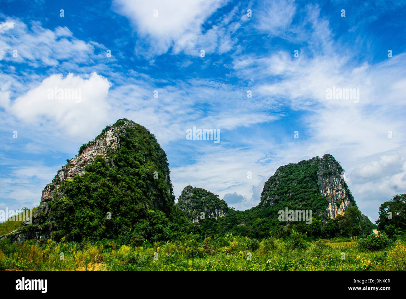 Beautiful karst mountains and rural scenery Stock Photo - Alamy