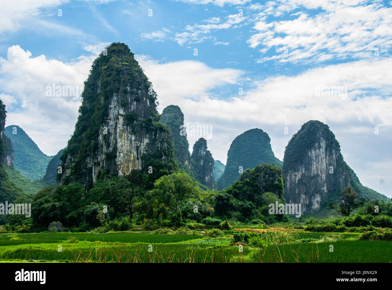 Beautiful karst mountains and rural scenery Stock Photo - Alamy