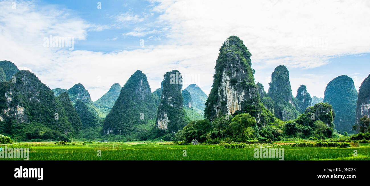 Beautiful karst mountains and rural scenery Stock Photo - Alamy