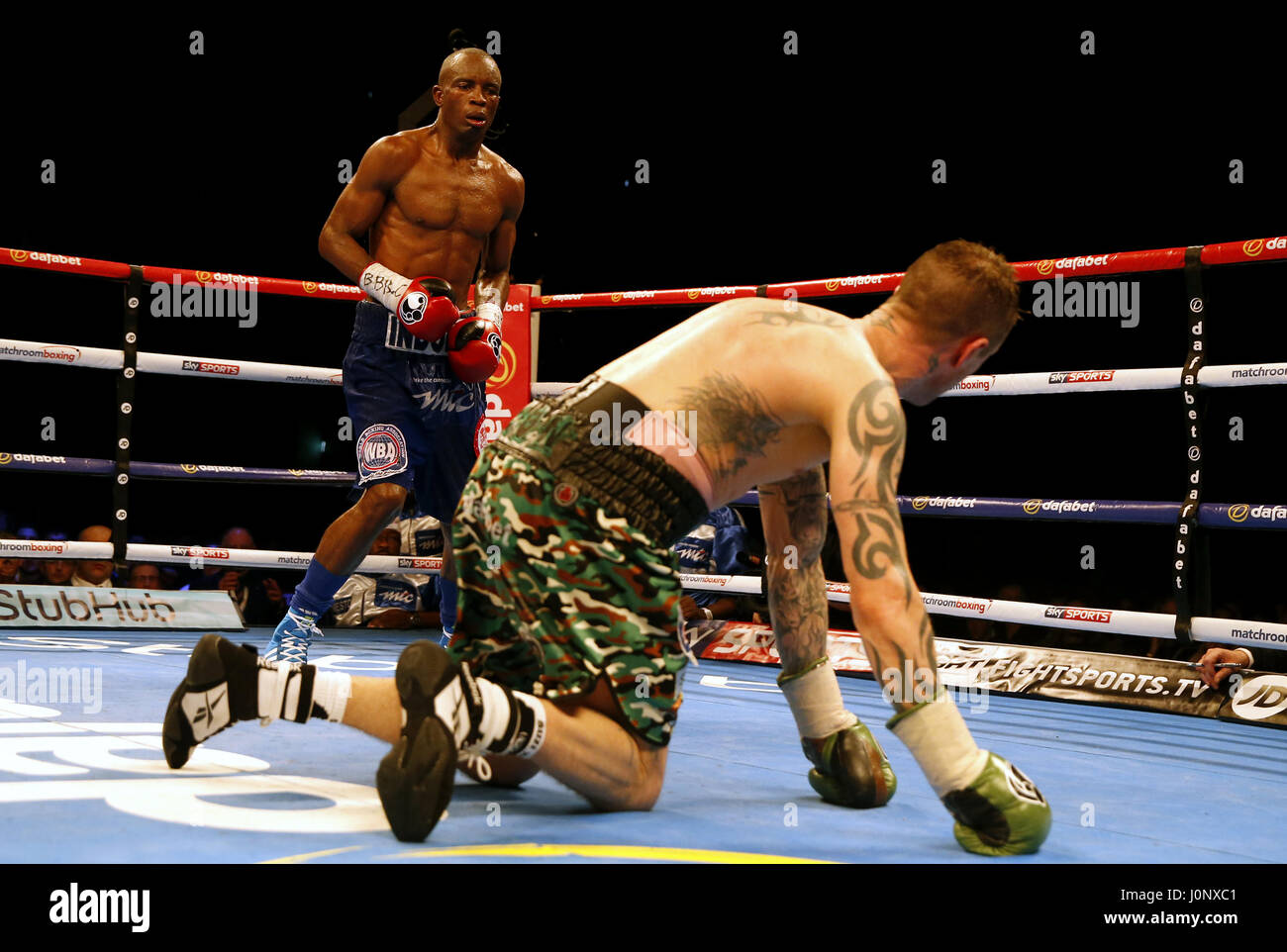 Ricky Burns on his knees against Julius Indongo during the WBA, IBF and ...
