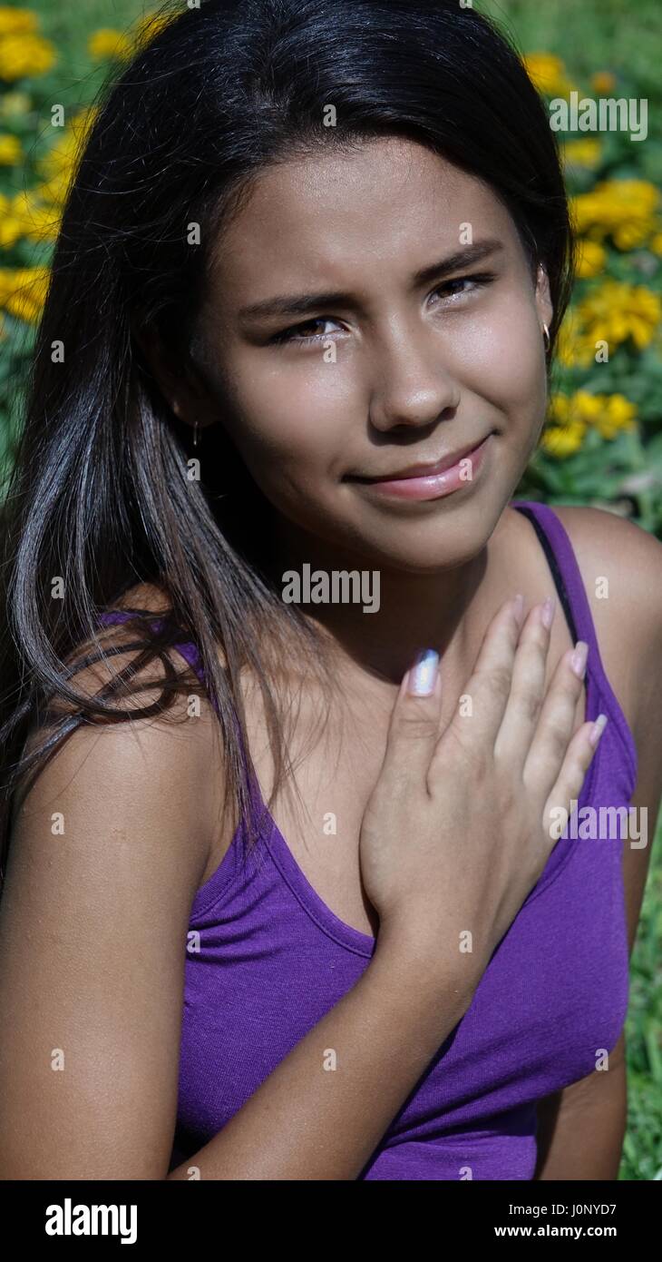 Teen Girl Hand Over Heart Stock Photo - Alamy