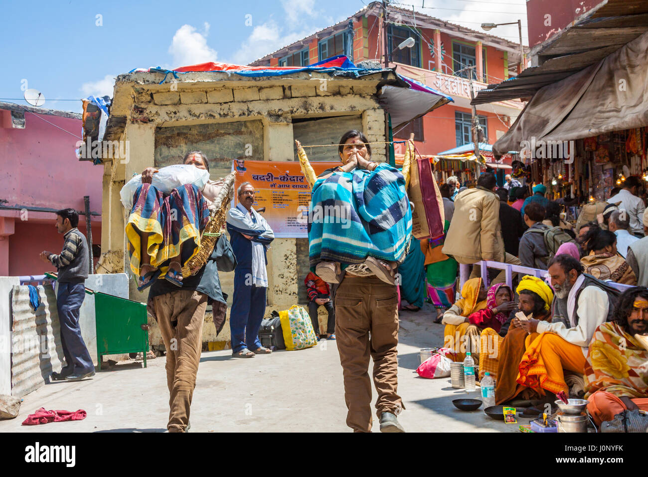 BADRINATH - INDIA, JUNE 5th - Porters carrying old pilgrims to the ...