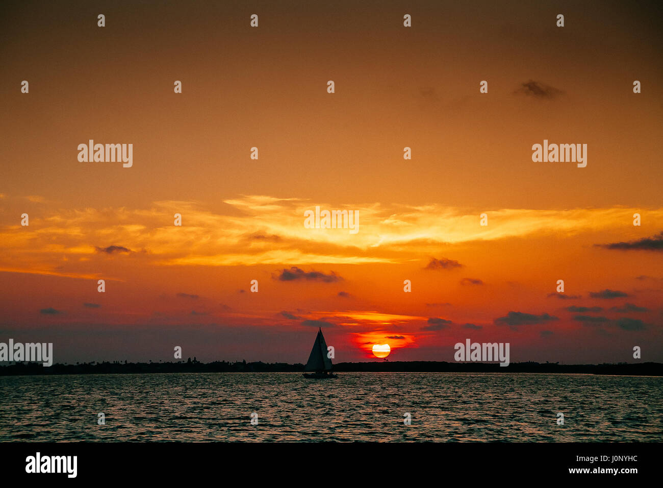 Sail Boat at Sunset Stock Photo - Alamy