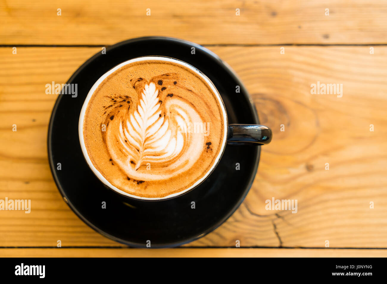 Hot Coffee Mocha on the brown wooden table with chocolate. Top view ...