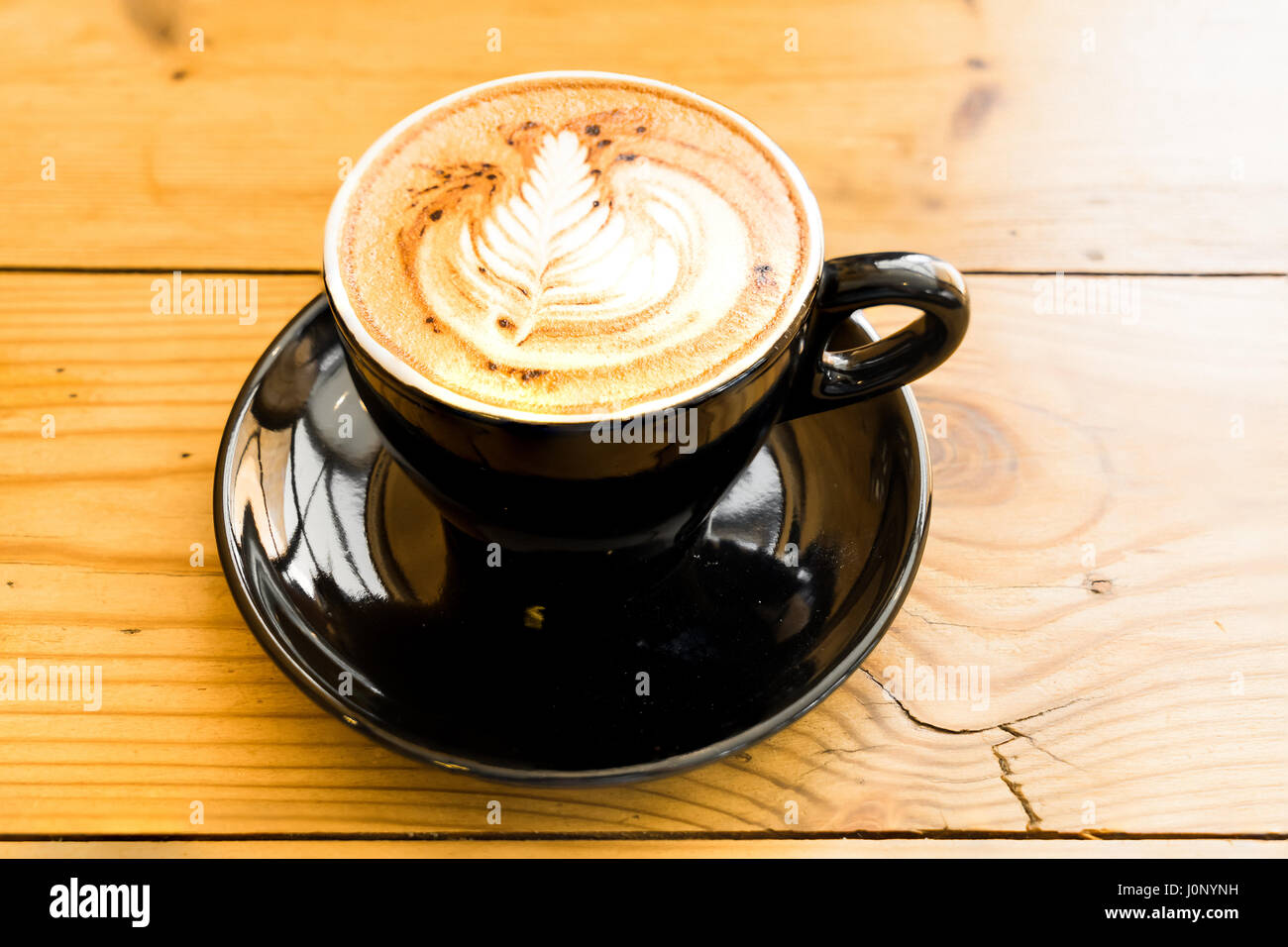 Hot Coffee Mocha on the brown wooden table with chocolate. Top view ...
