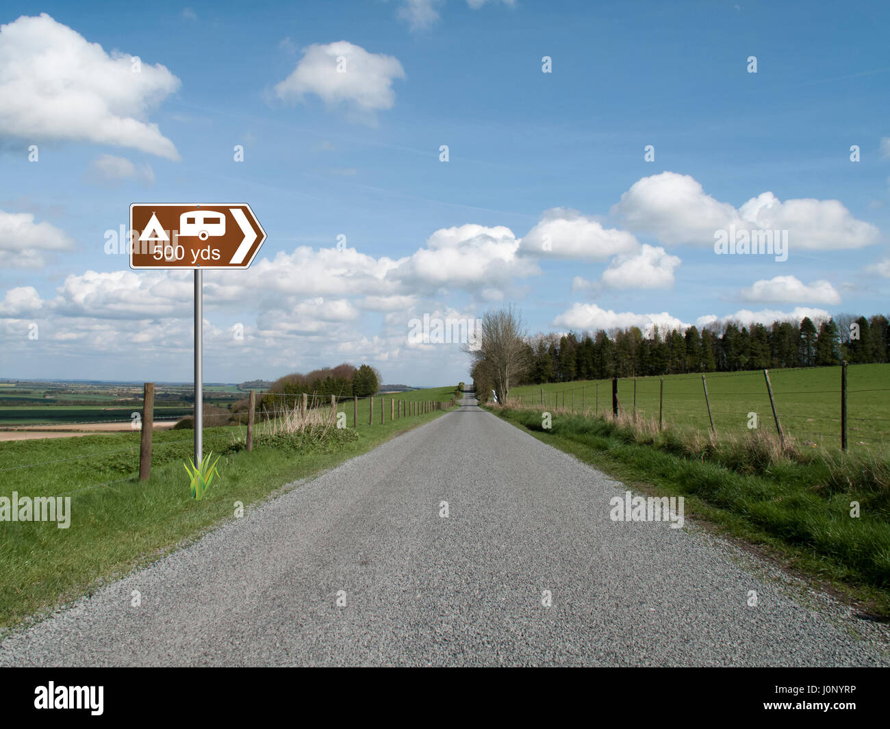 Camp site 500 yards information sign graphic on single country lane ...