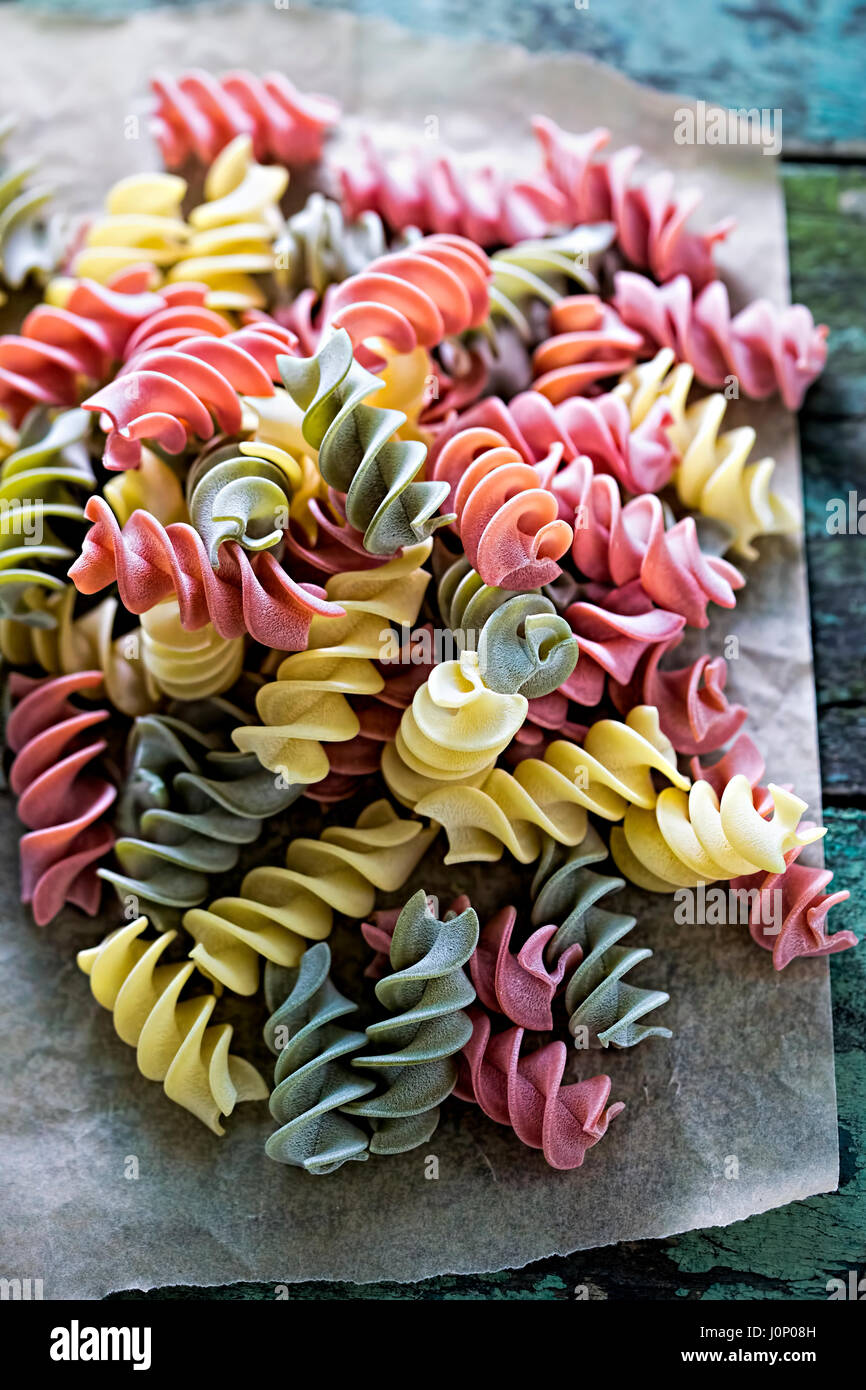 Uncooked three coloured pasta Stock Photo - Alamy
