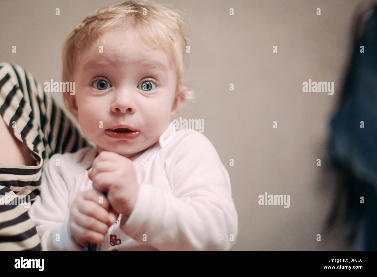 beautiful little girl is very surprised Stock Photo - Alamy