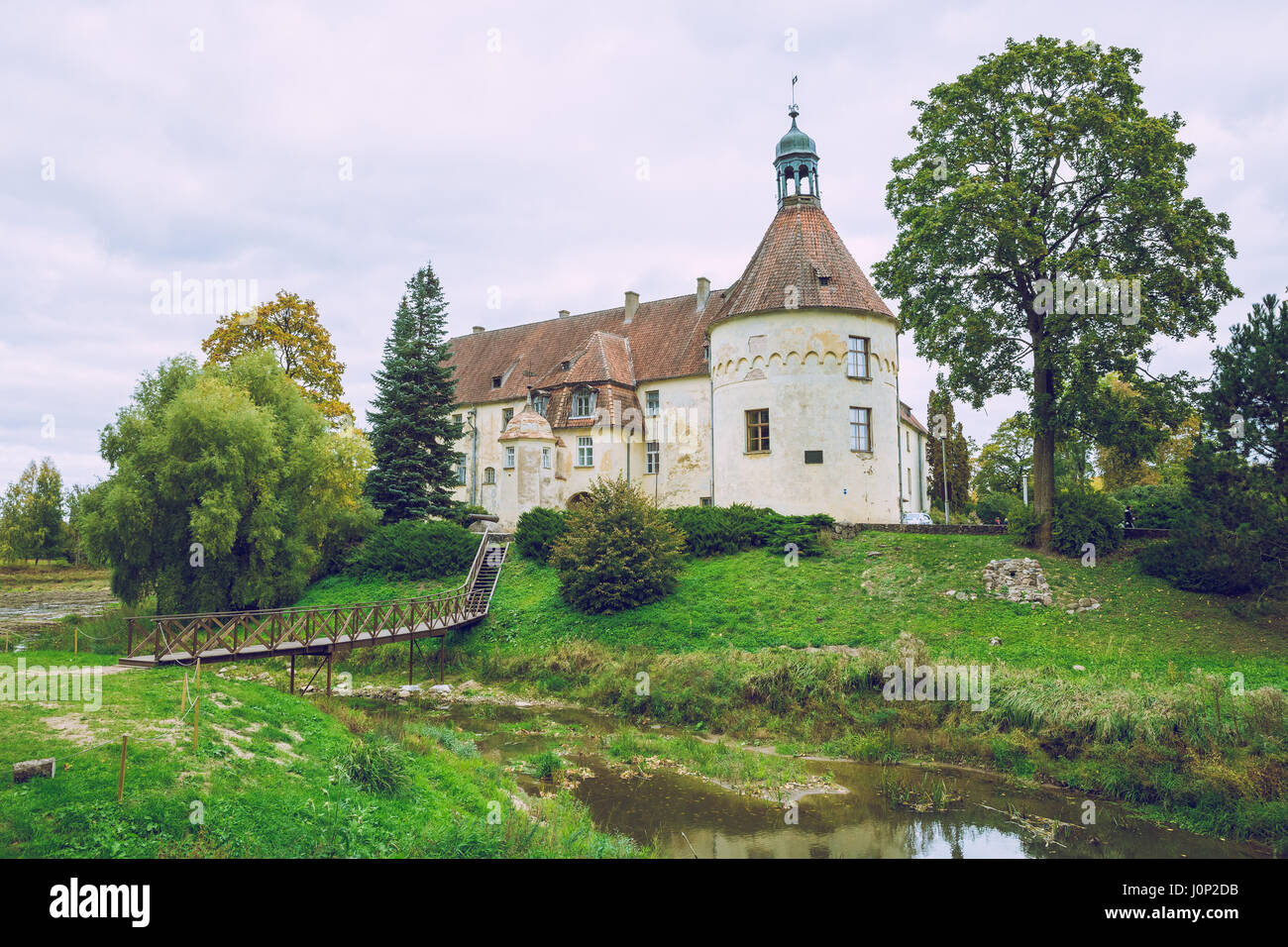 Welcome to medieval castle in Bauska Stock Photo - Alamy
