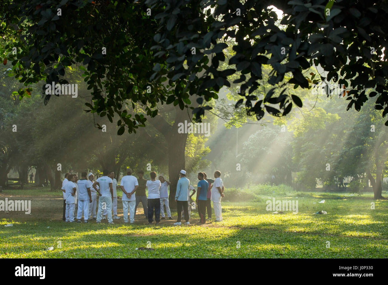 Dhaka residents exercise in the Ramna Park in a winter morning. Dhaka ...