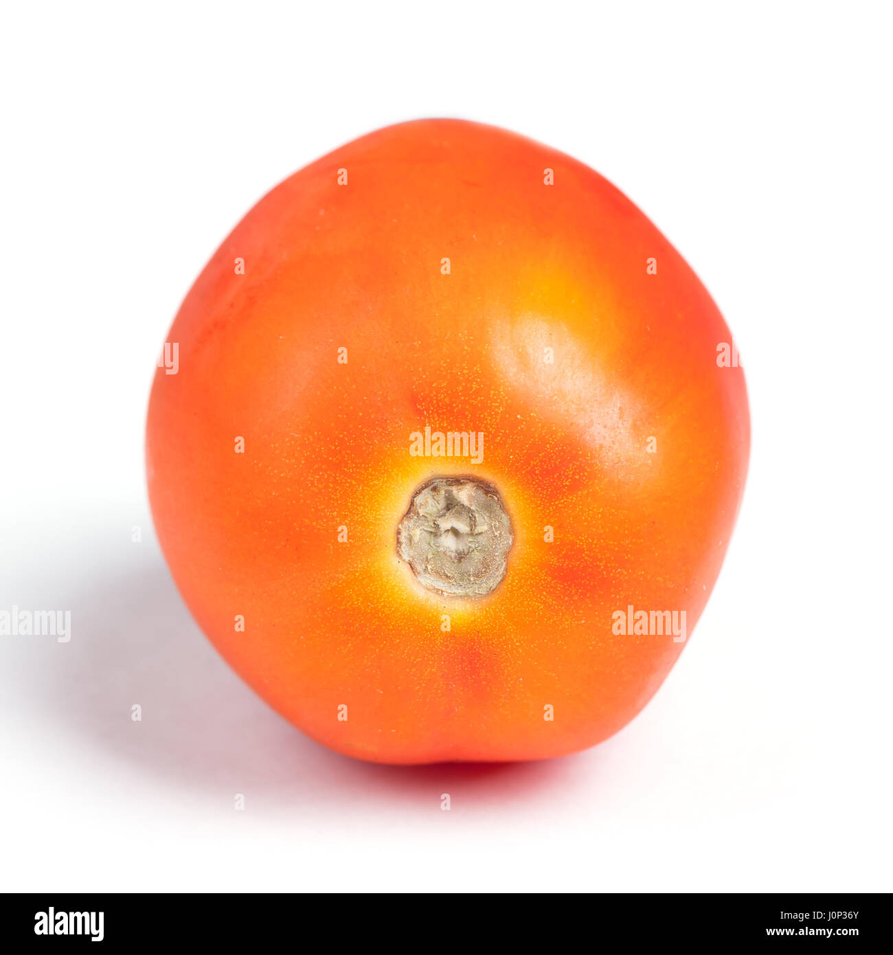 One tomato isolated on white background Stock Photo - Alamy
