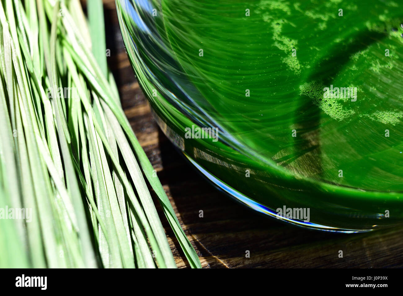 Fresh wheat grass juice close-up Stock Photo - Alamy