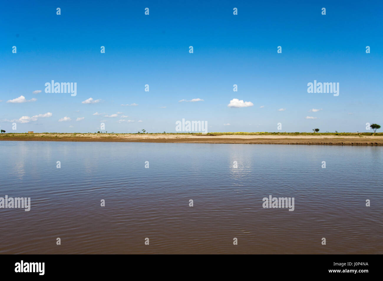 Clouds shadow in the river water Stock Photo - Alamy