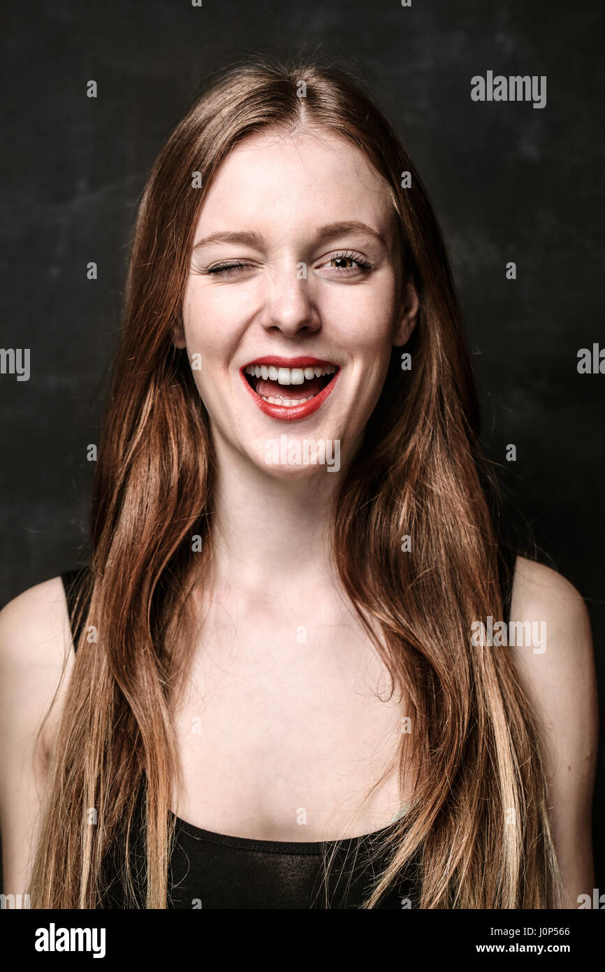 Portrait winking young hi-res stock photography and images - Alamy