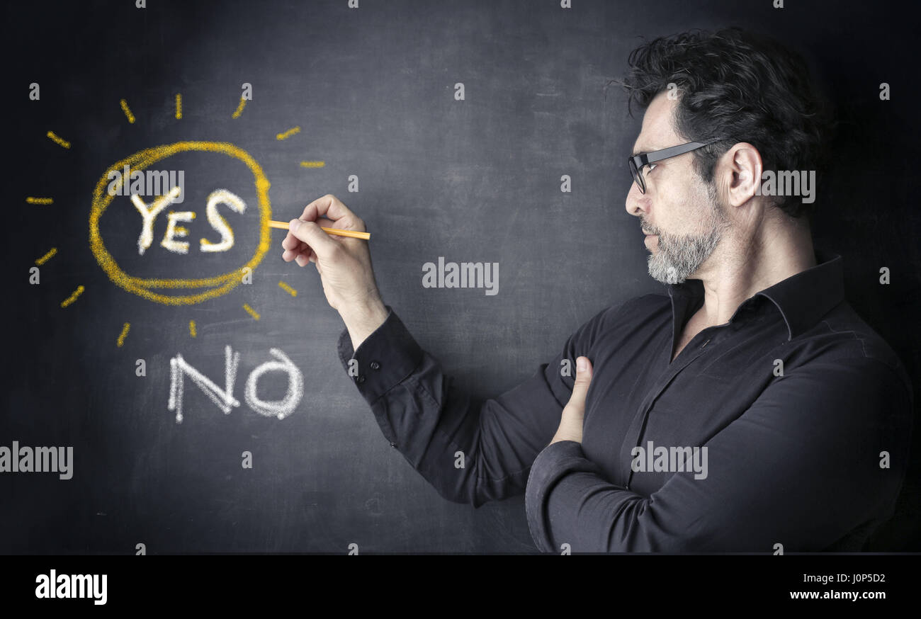Businessman choosing yes instead of no Stock Photo - Alamy