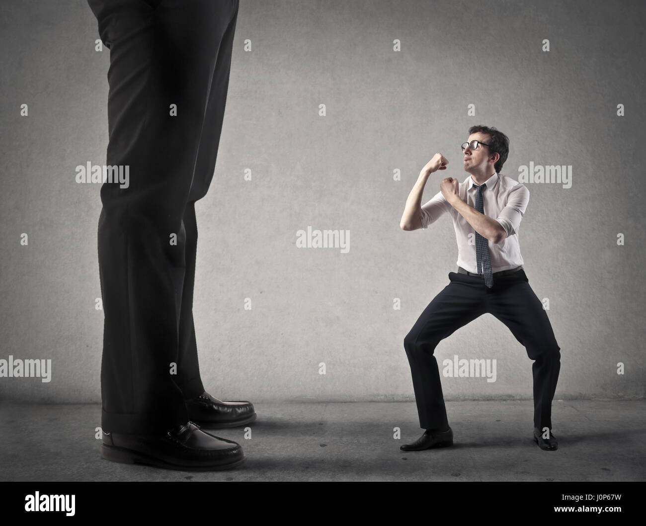 Big man little man fight hi-res stock photography and images - Alamy
