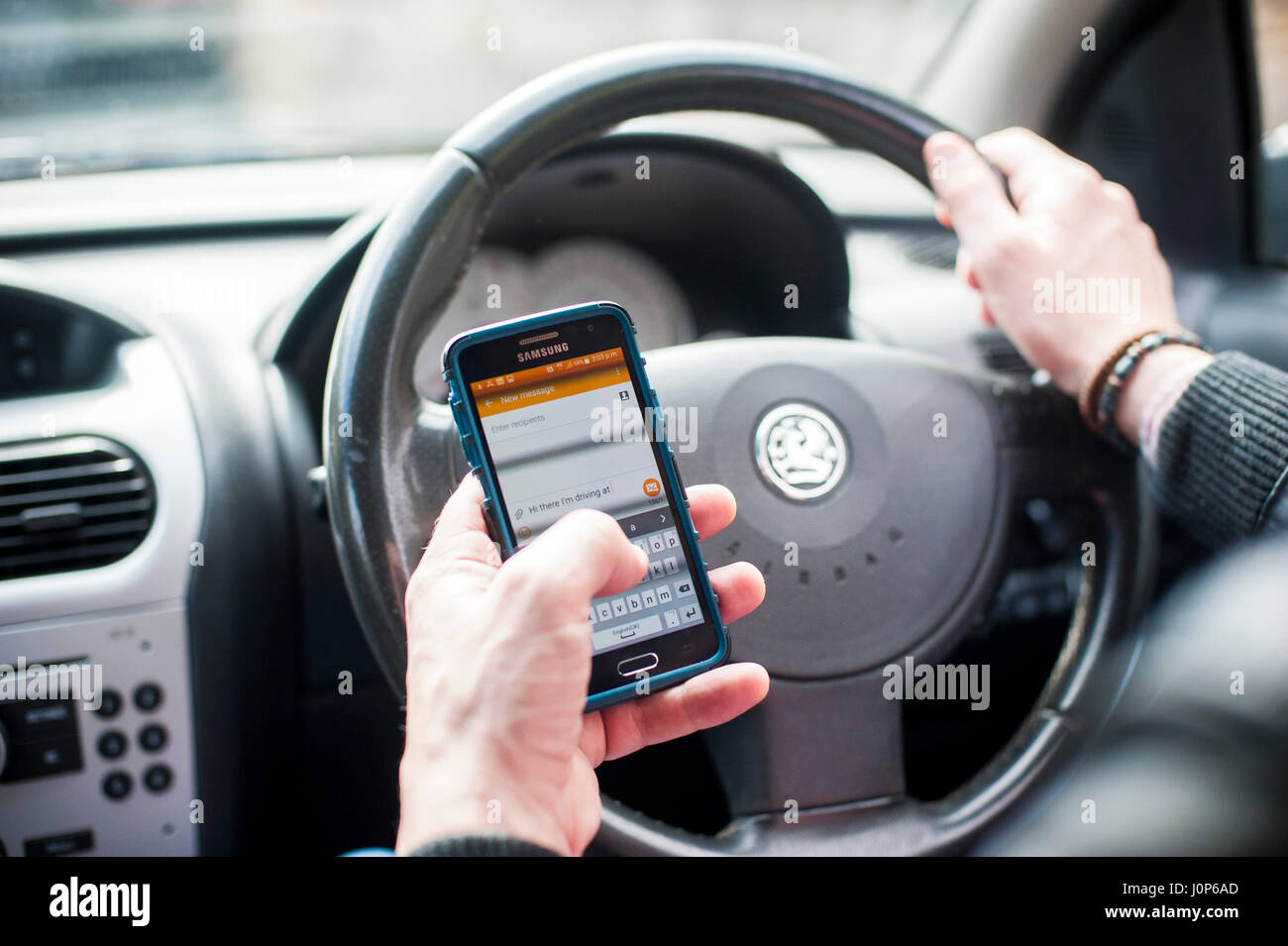 Reading whilst driving hi-res stock photography and images - Alamy