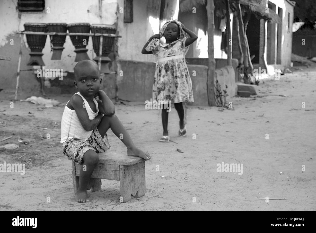 Black and white of 2 Senegalese children in front of their house Stock ...