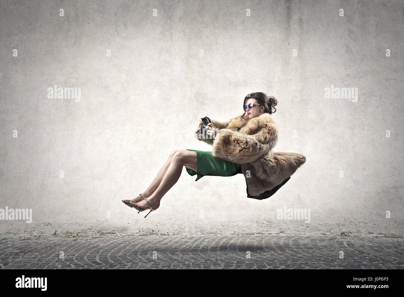 Luxurious woman driving invisible car Stock Photo - Alamy
