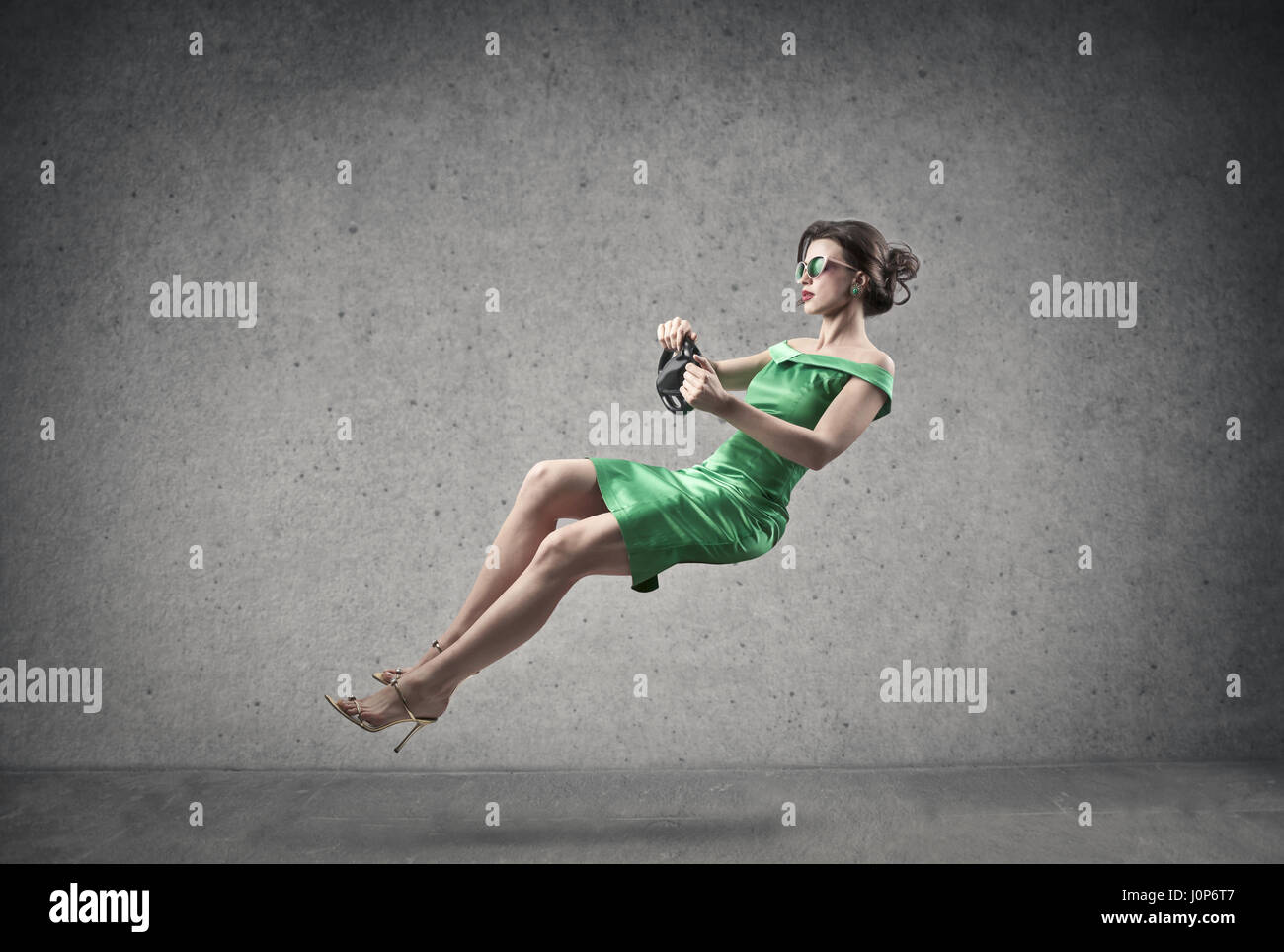 Woman driving invisible car Stock Photo - Alamy