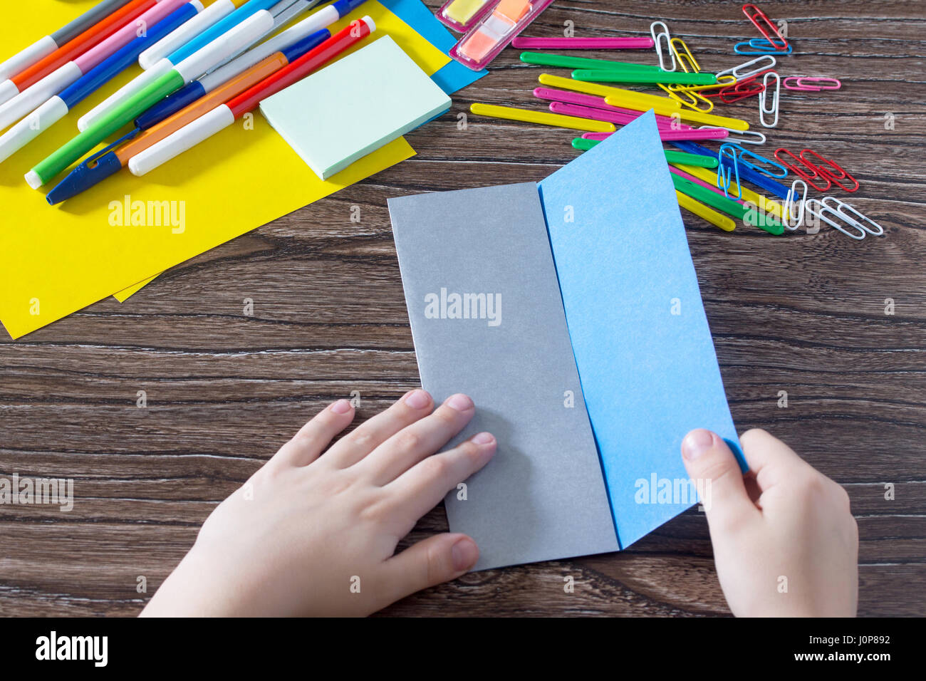 A children's office organizer made of paper is filled with office ...