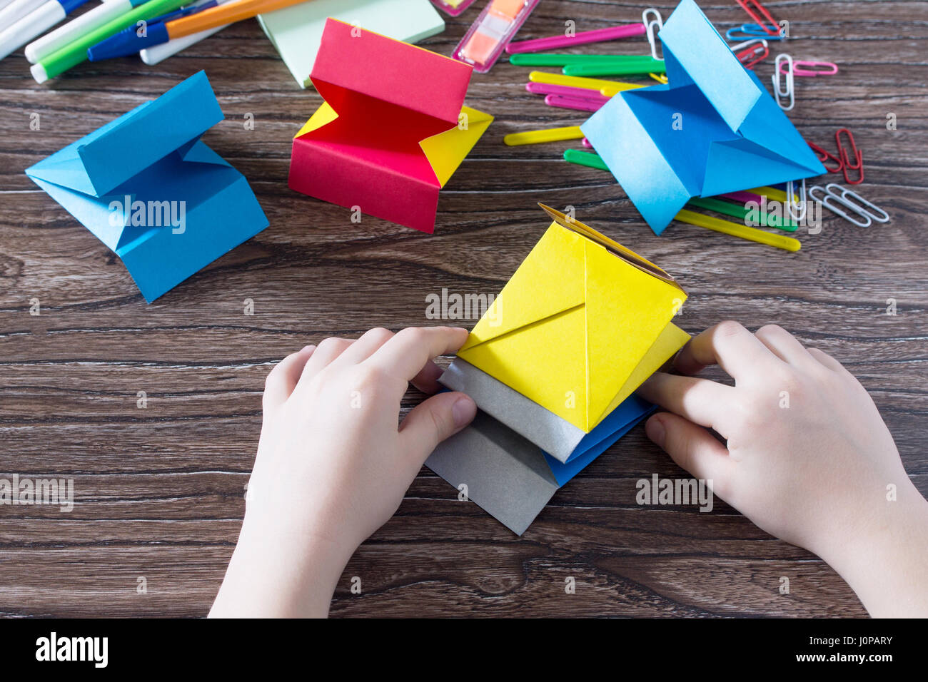 A children's office organizer made of paper is filled with office ...