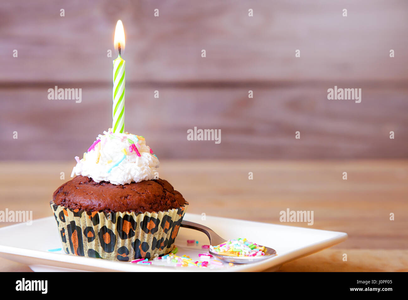 Birthday cupcake on table Stock Photo - Alamy