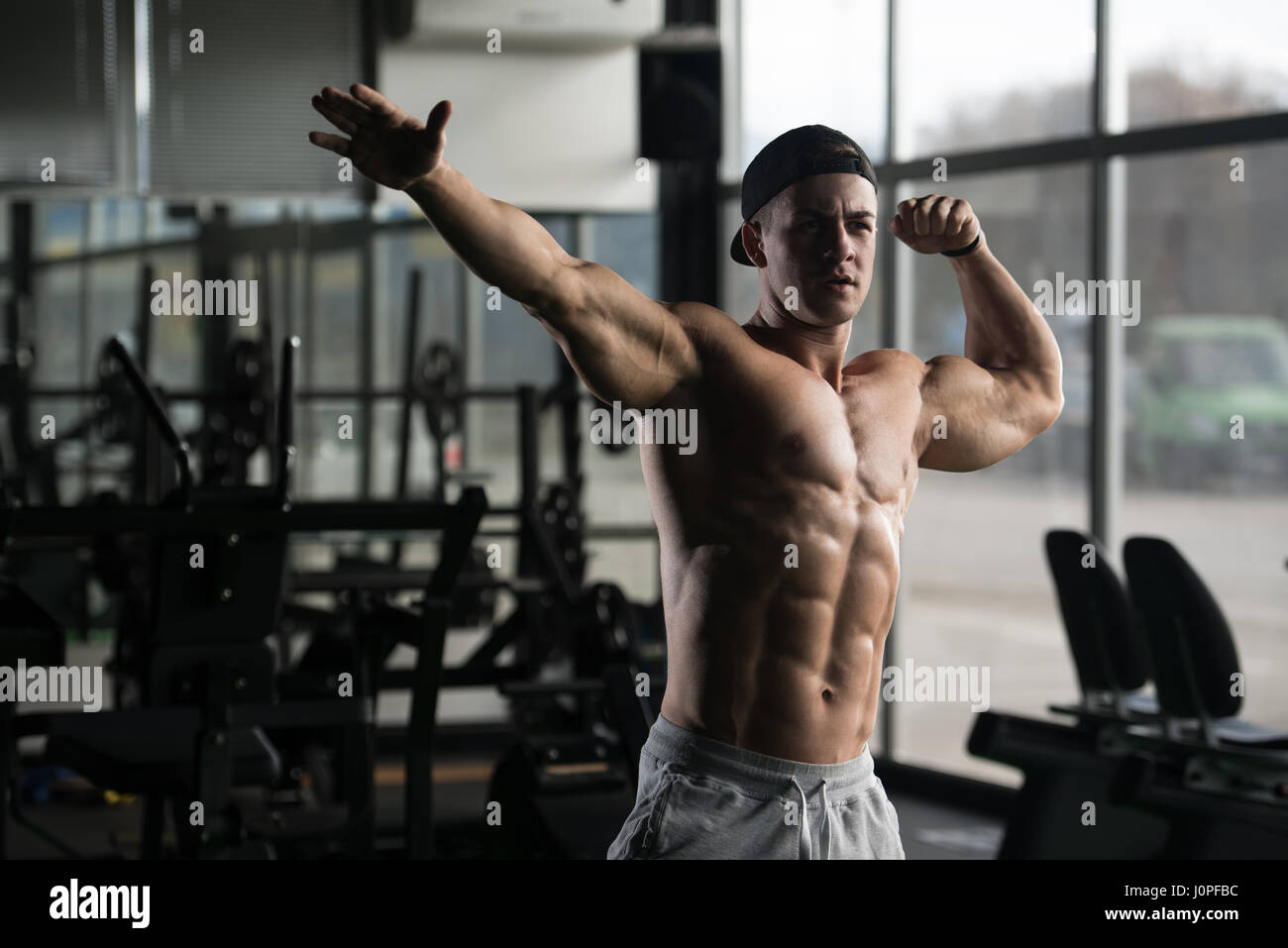 Portrait Of A Young Physically Fit Man Showing His Well Trained Body ...