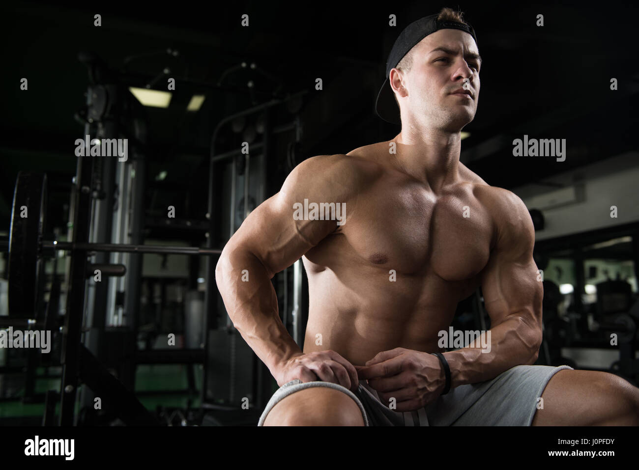 Resting Time - Confident Muscled Young Man Resting In Healthy Club Gym ...