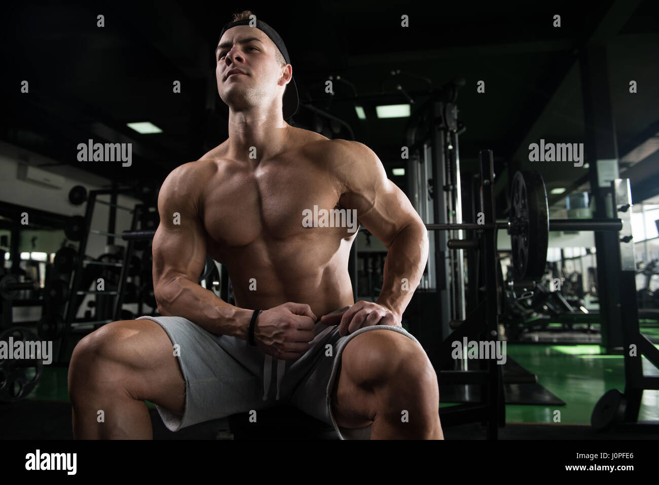Resting Time - Confident Muscled Young Man Resting In Healthy Club Gym ...