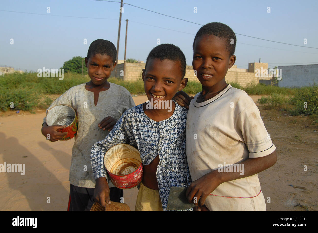 Children usually begging for food and money, now posing for group ...