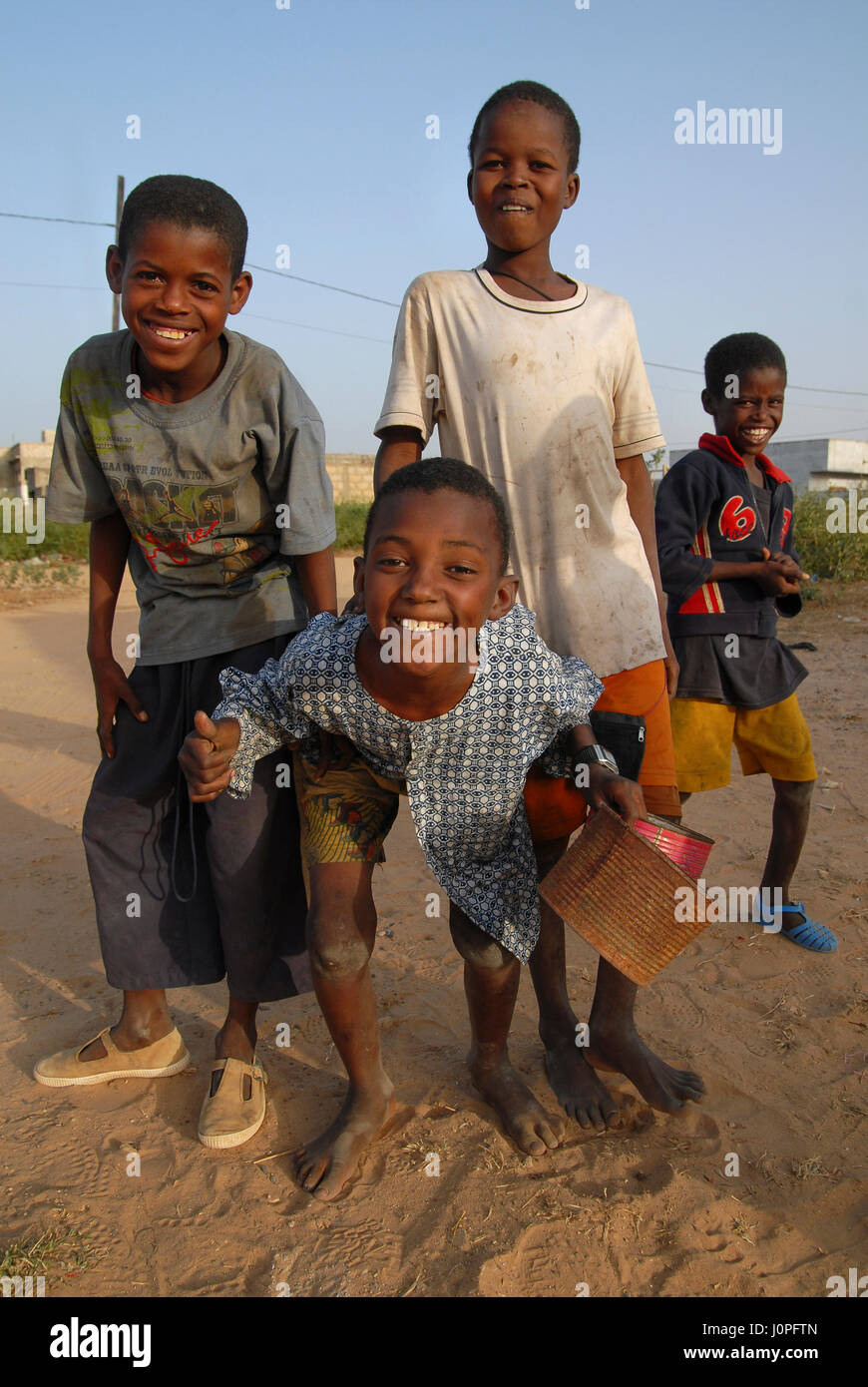 Children usually begging for food and money, now posing for group ...