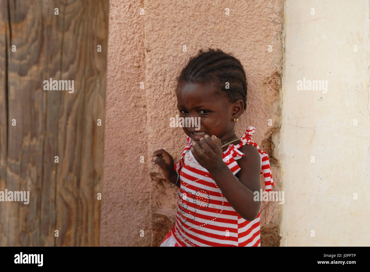crying Senegalese girl Stock Photo - Alamy