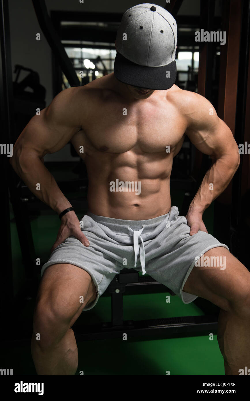 Resting Time - Confident Muscled Young Man Resting In Healthy Club Gym ...