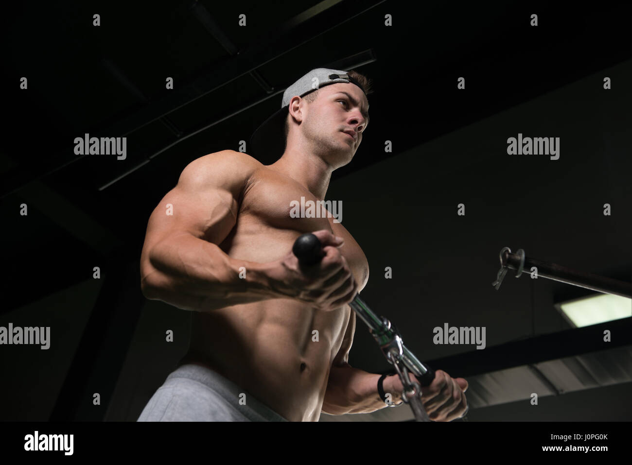Handsome Muscular Fitness Bodybuilder Doing Heavy Weight Exercise For ...