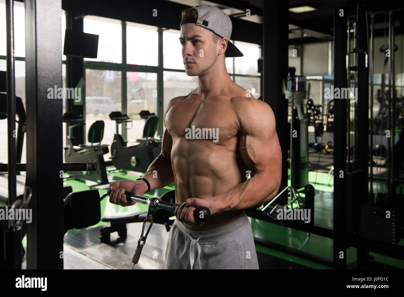Handsome Muscular Fitness Bodybuilder Doing Heavy Weight Exercise For ...