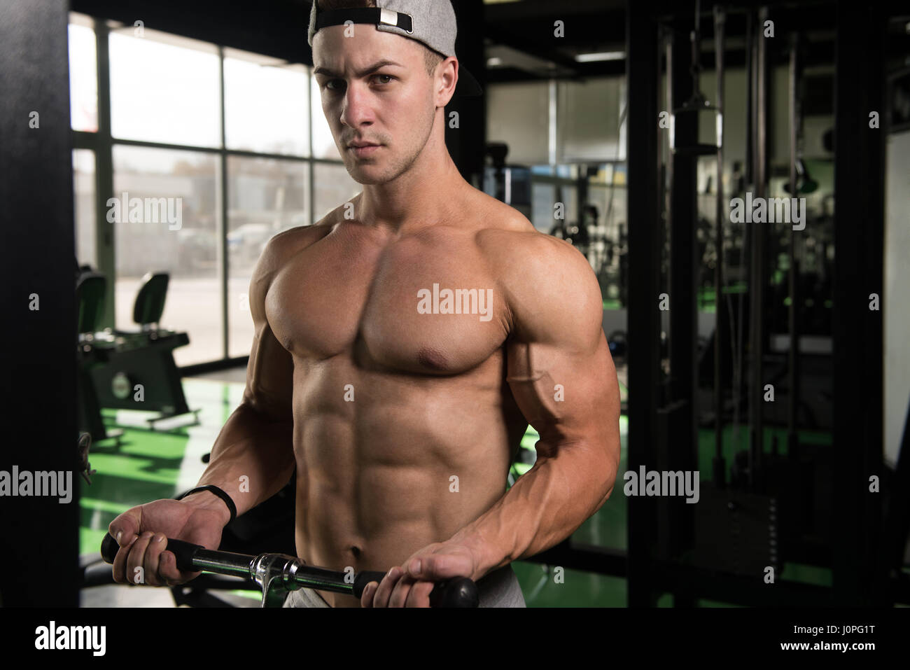 Handsome Muscular Fitness Bodybuilder Doing Heavy Weight Exercise For ...